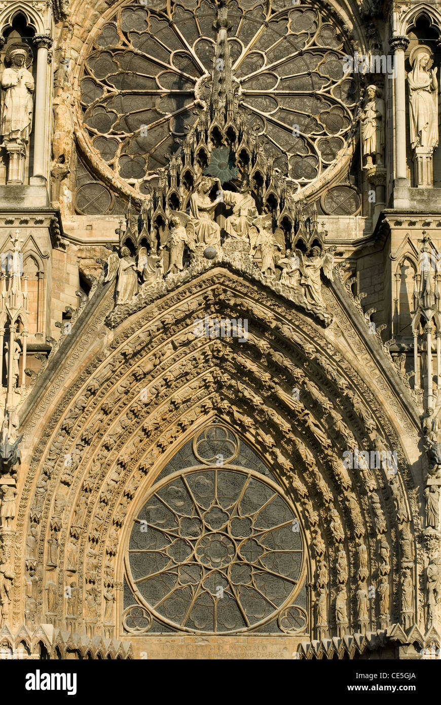The engraved stonework surrounding the windows of Reims Cathedral ...