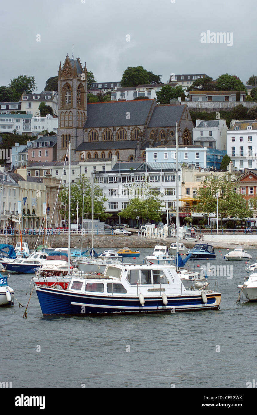 View across the harbor and boats towards St John's Church, Torquay ...