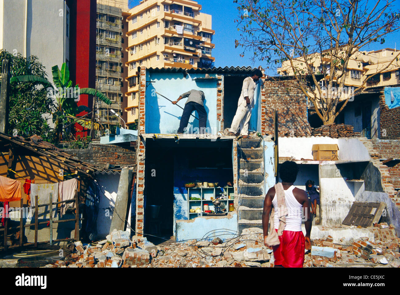 Slum house illegal demolished broken below modern buildings bombay ...