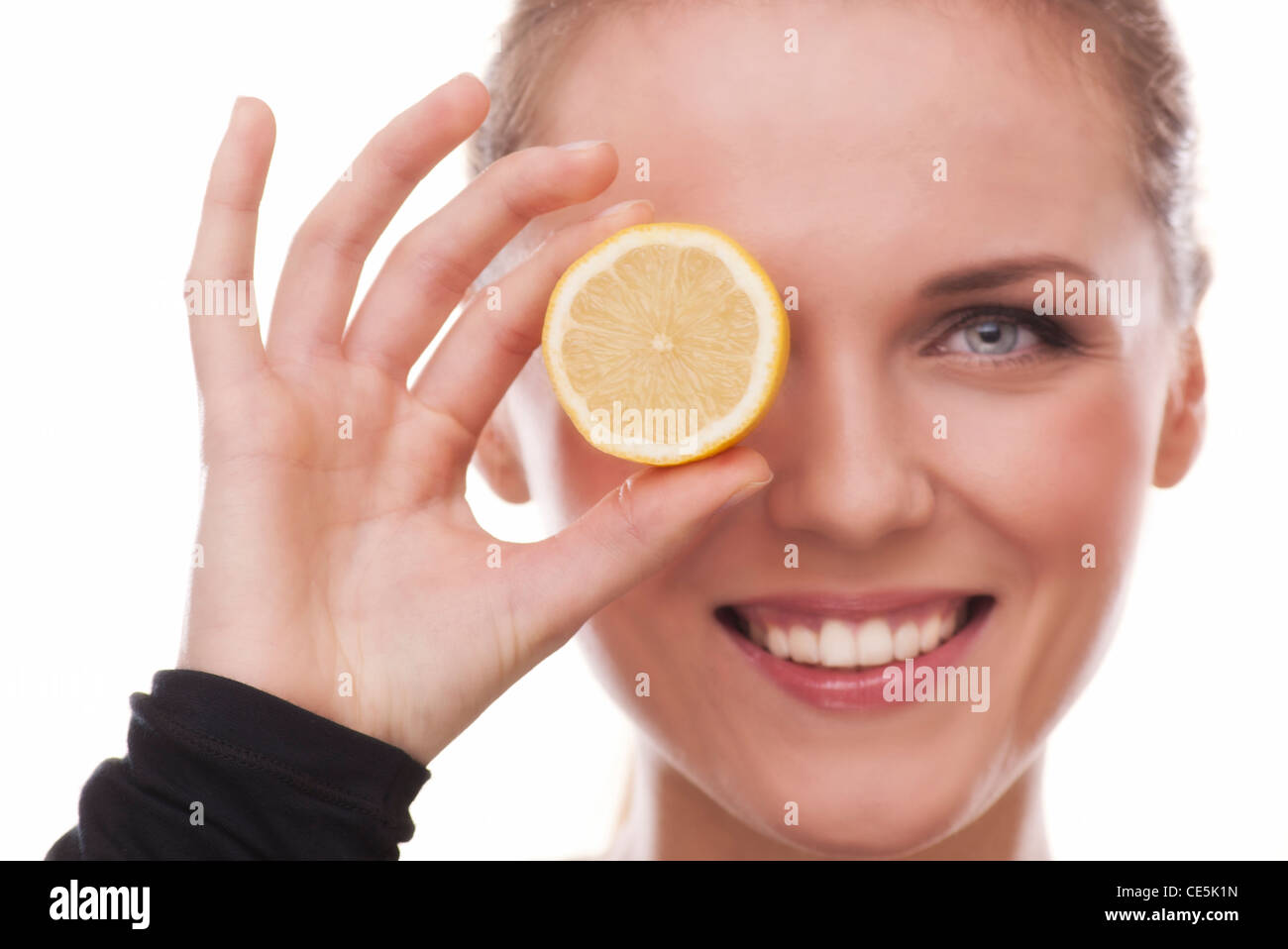 Covering eye with lemon hi-res stock photography and images - Alamy