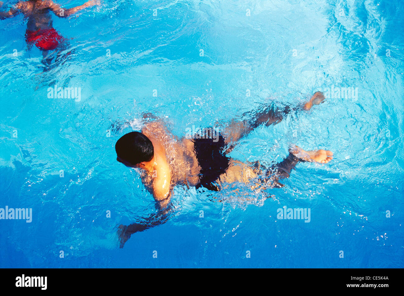 Indian man outdoor swimming pool hi-res stock photography and images ...