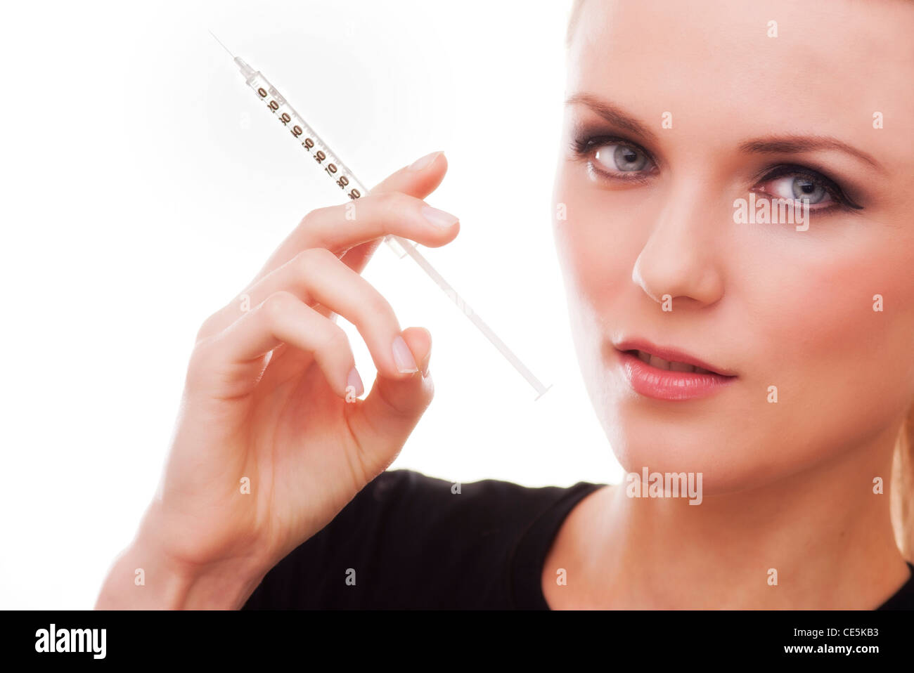 woman holding a syringe Stock Photo - Alamy