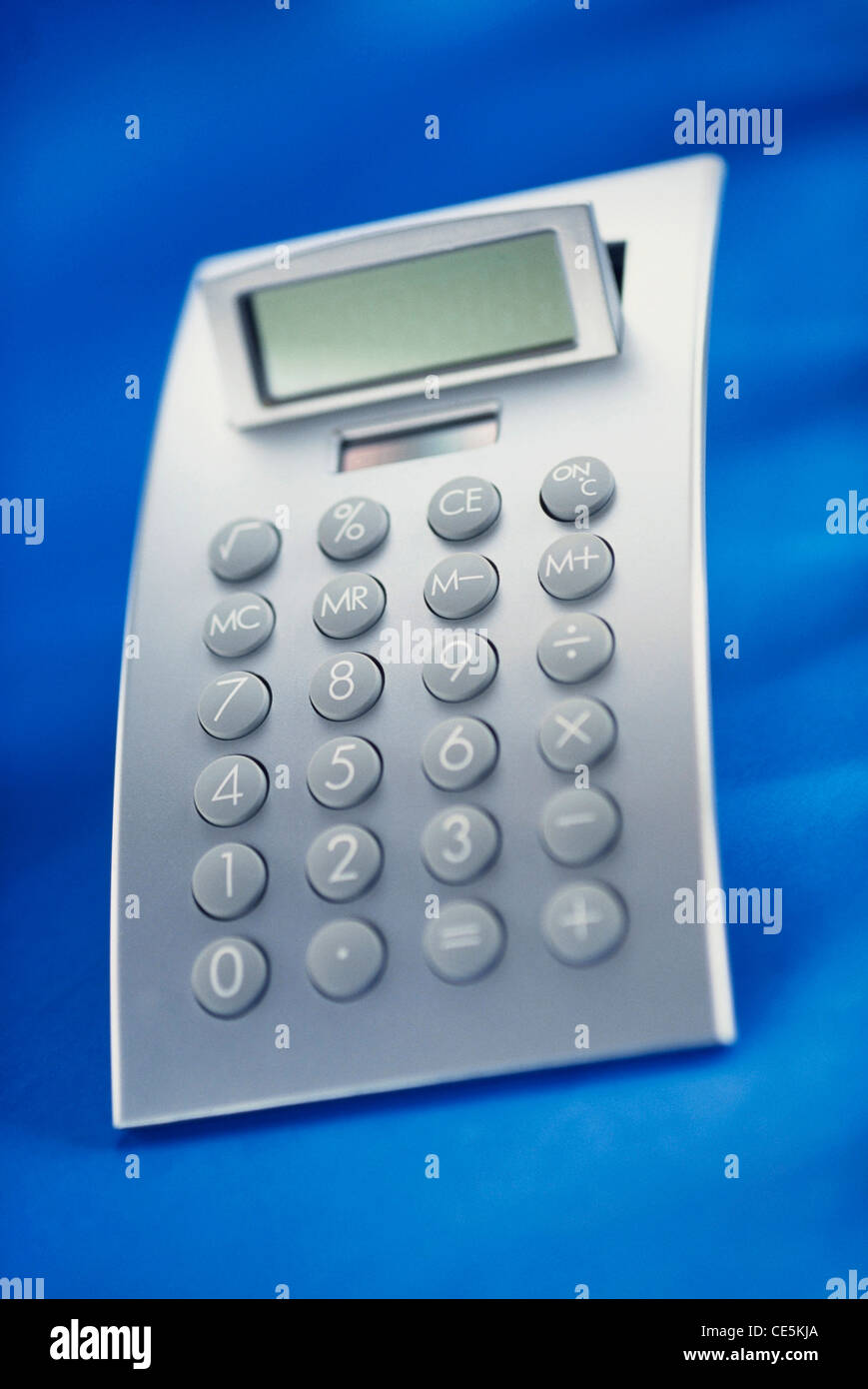 calculator on blue background Stock Photo - Alamy