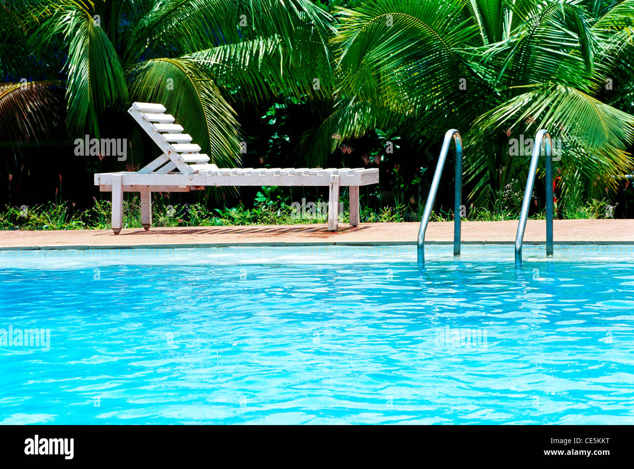Swimming Pool handrail sun desk sunbed lounge lounger Stock Photo - Alamy