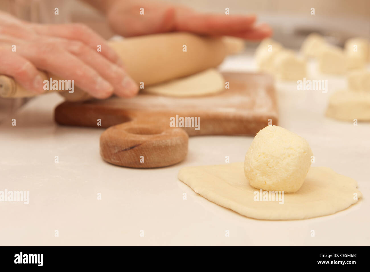 Female cook rolling dough with rolling-pin. Closeup view Stock Photo ...
