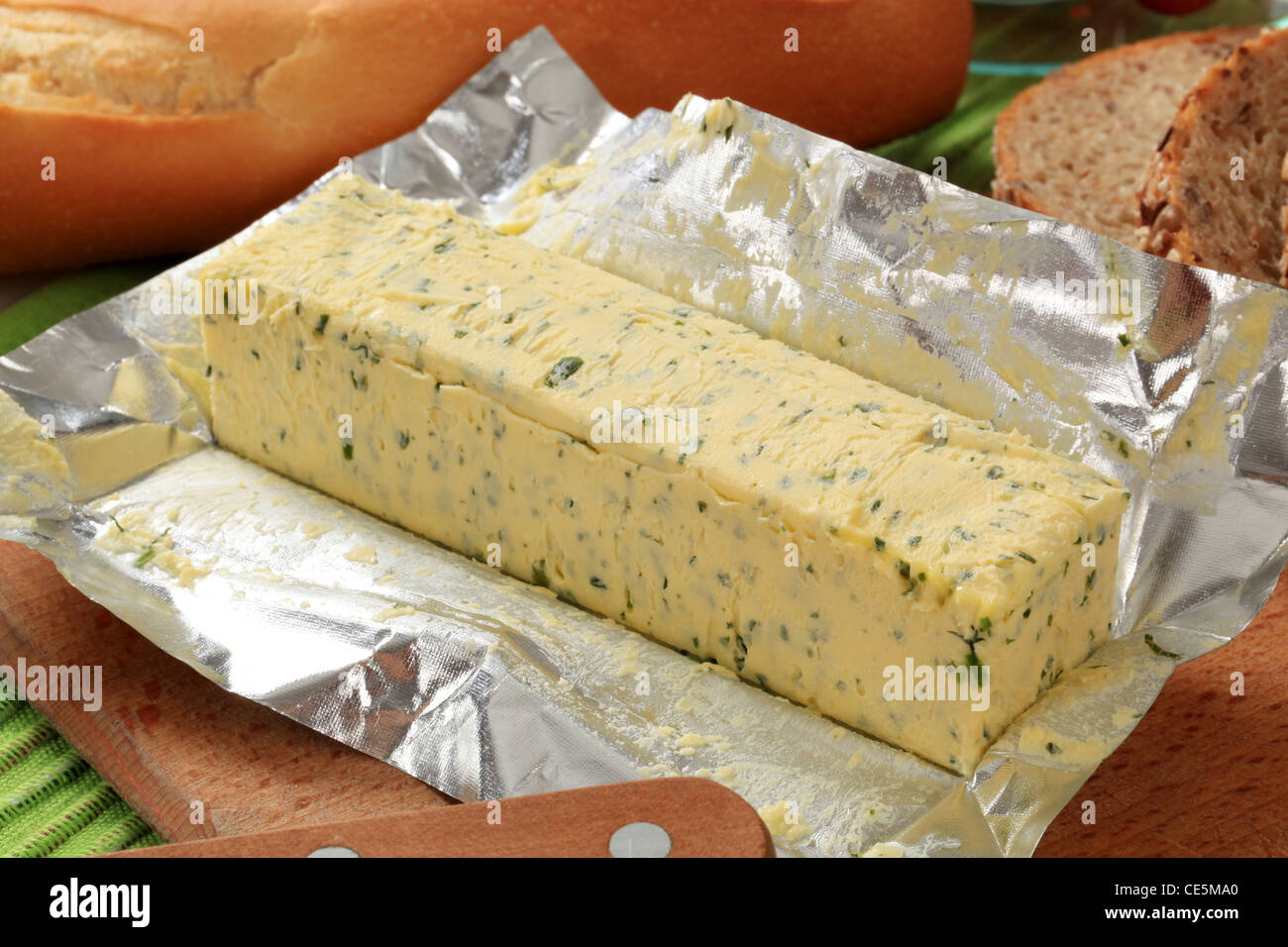 Stick of fresh herb butter and bread Stock Photo - Alamy