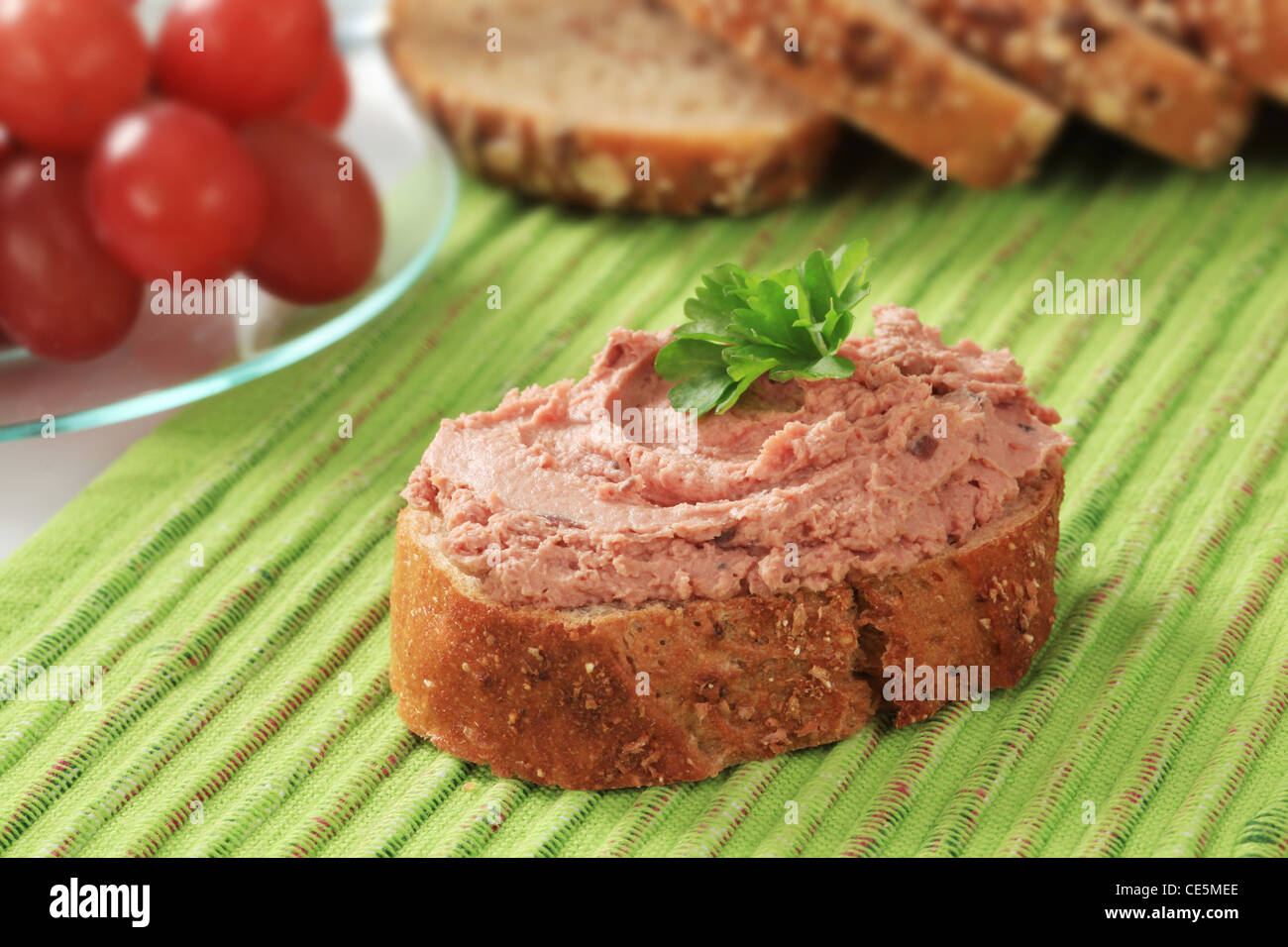 Slice of bread roll and liver pate Stock Photo - Alamy