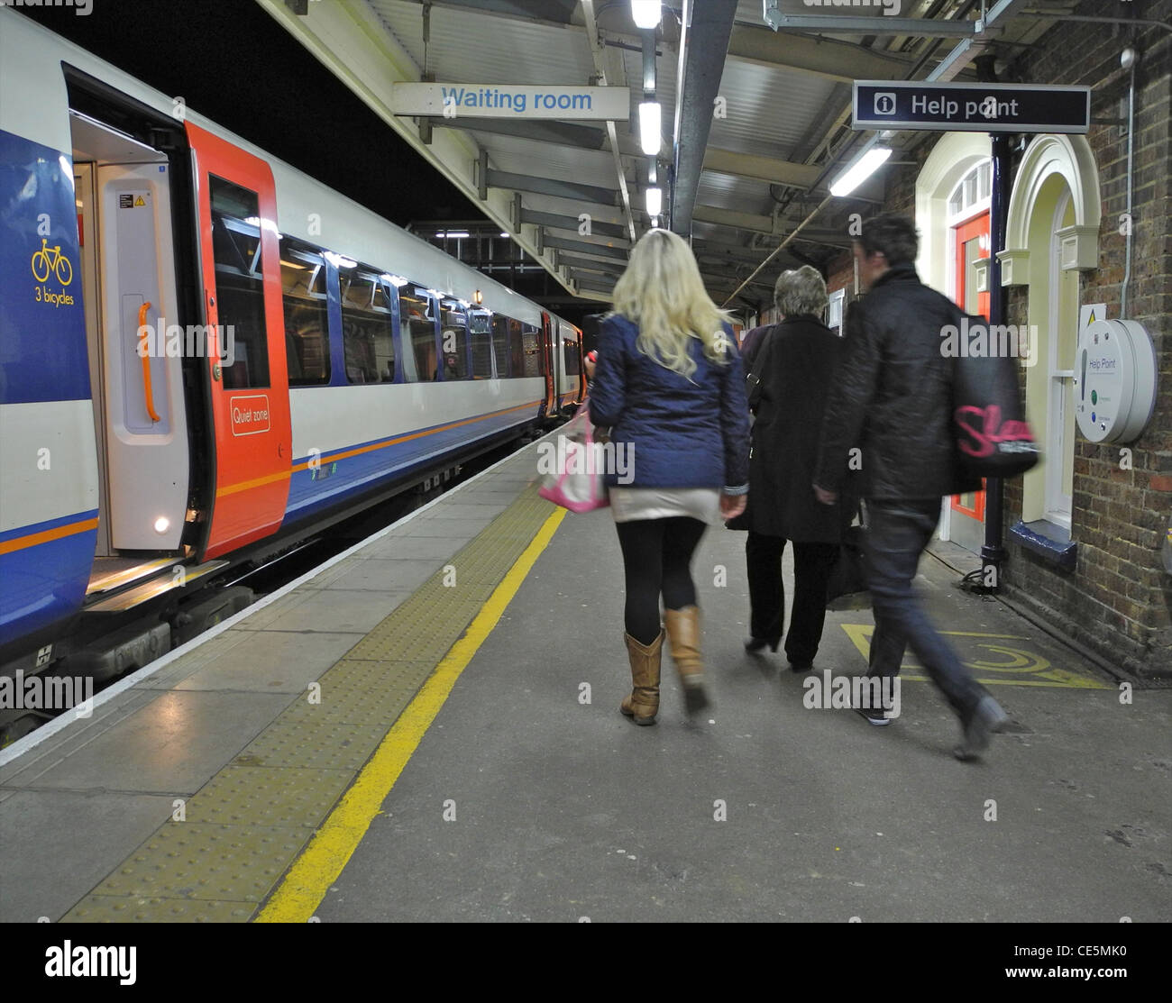 Passengers arriving on UK railway platform station EDITORIAL USE ONLY ...