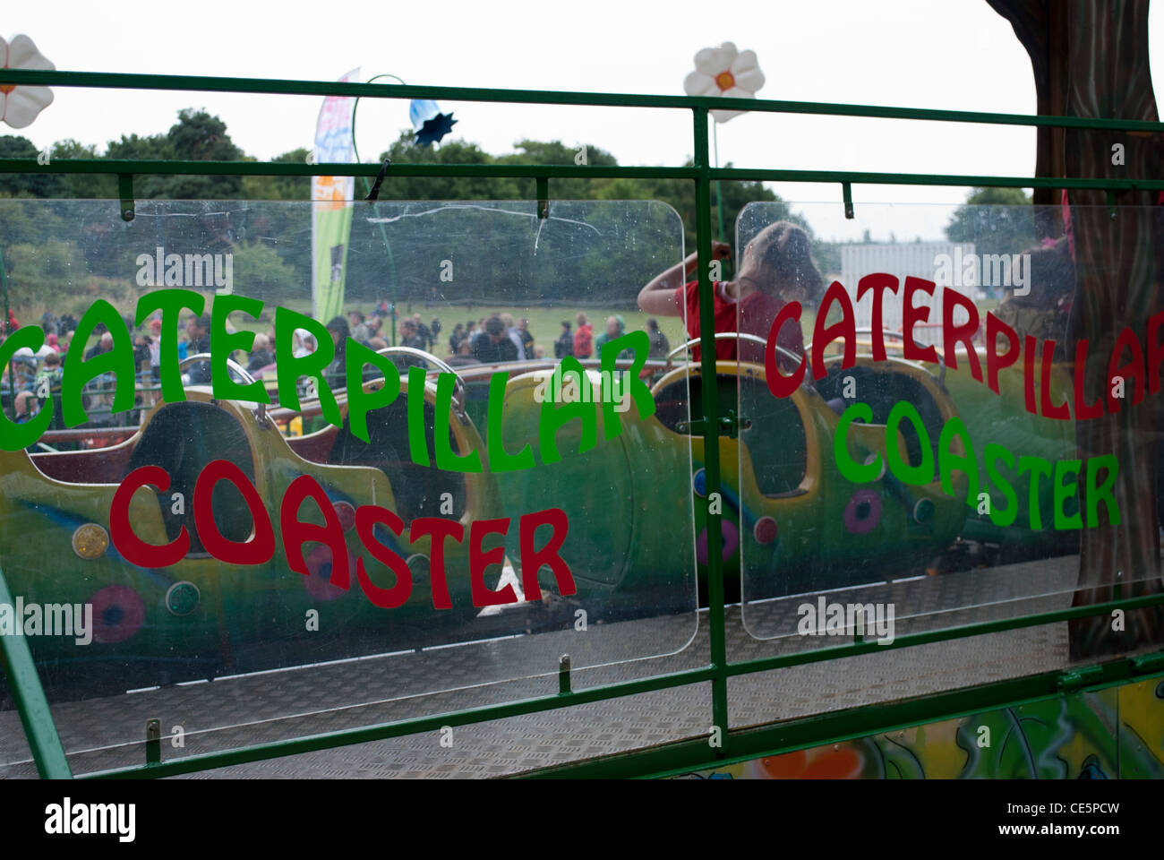 Safety barrier labeled with 'Caterpillar Coaster' in front of ...