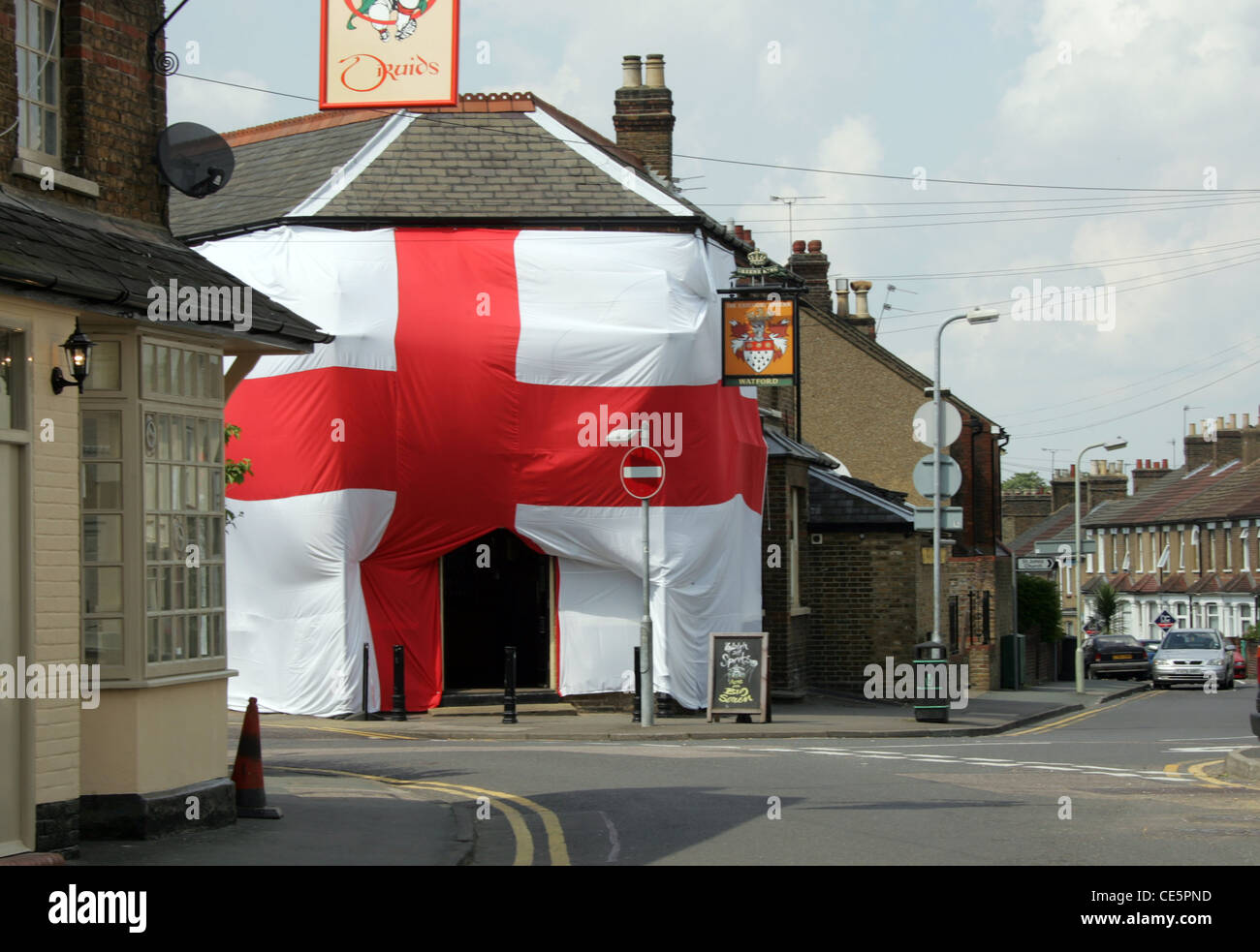 Pub covered in huge flag of St George Stock Photo - Alamy