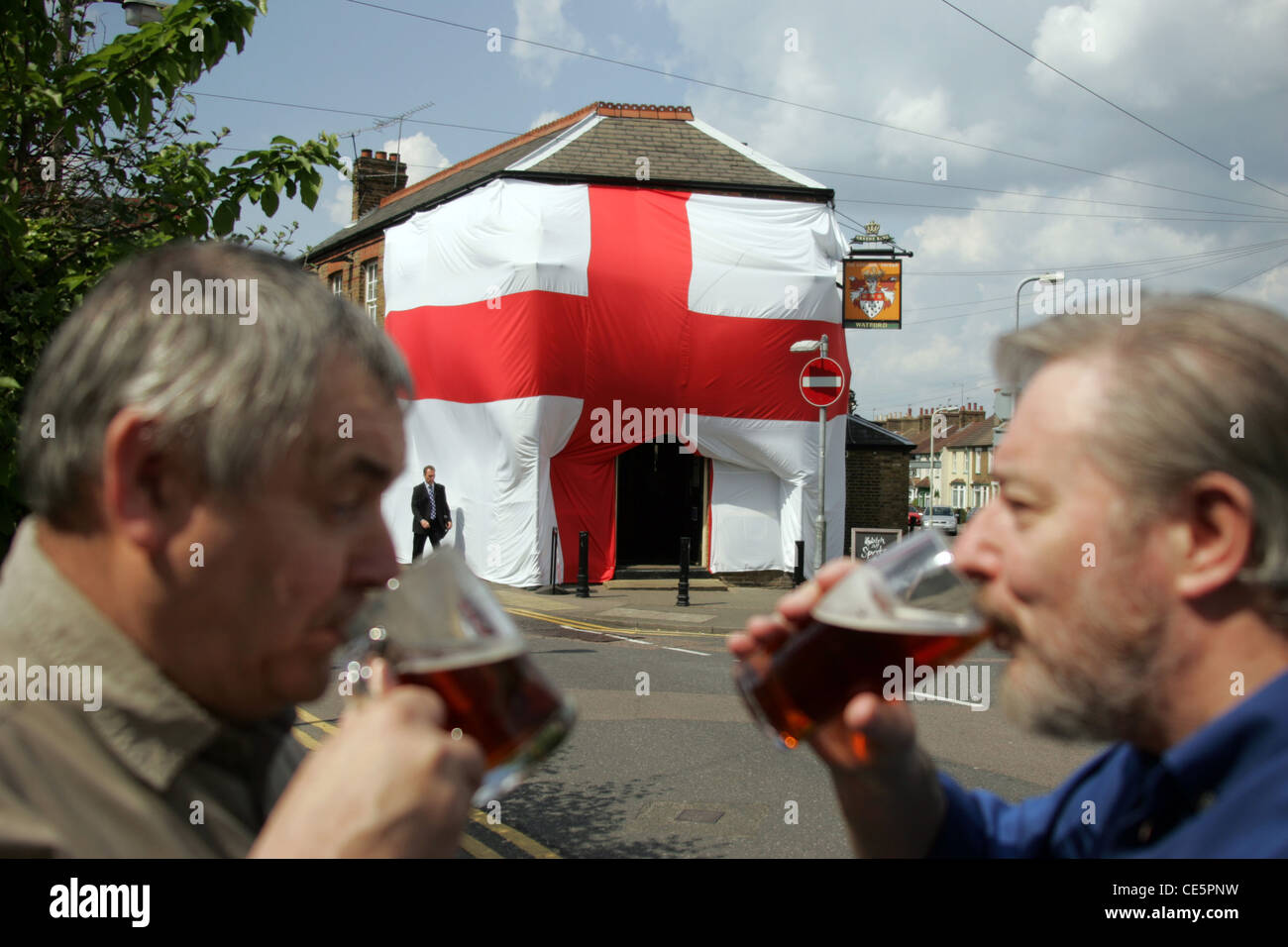Pub covered in huge flag of St George Stock Photo - Alamy