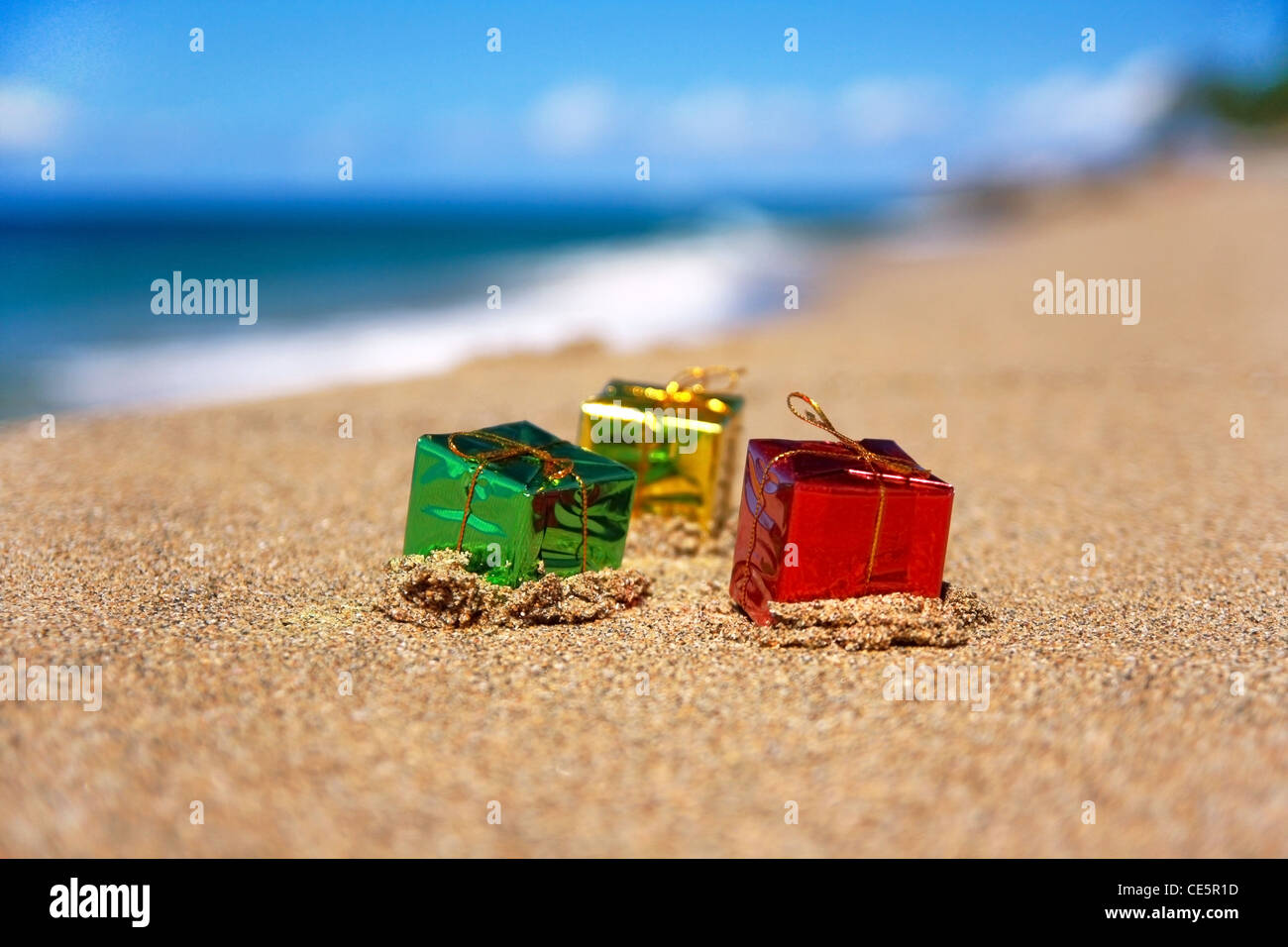 Present boxes on beach of ocean Stock Photo - Alamy