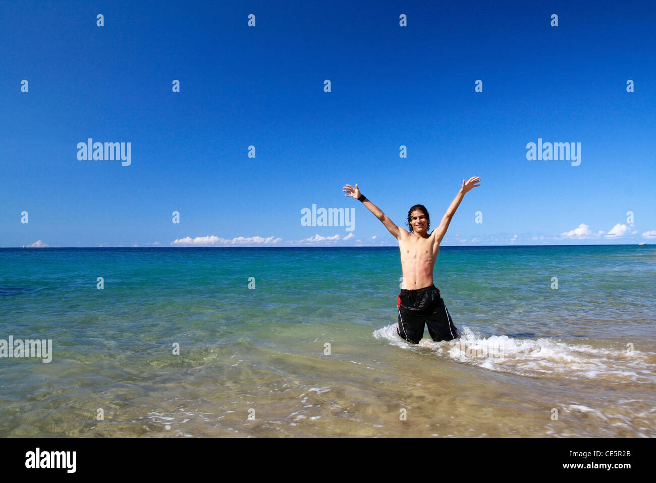 Happy man on beach, Atlantic ocean Stock Photo - Alamy