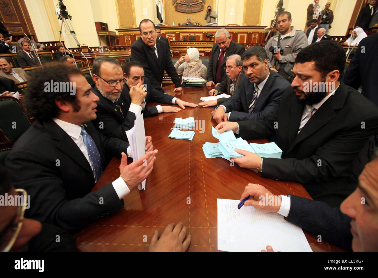 Parliament members count ballots after the voting for a new parliament ...