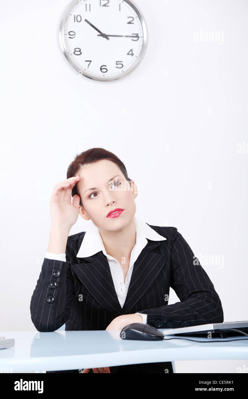 Thinking businesswoman sitting in the office Stock Photo - Alamy