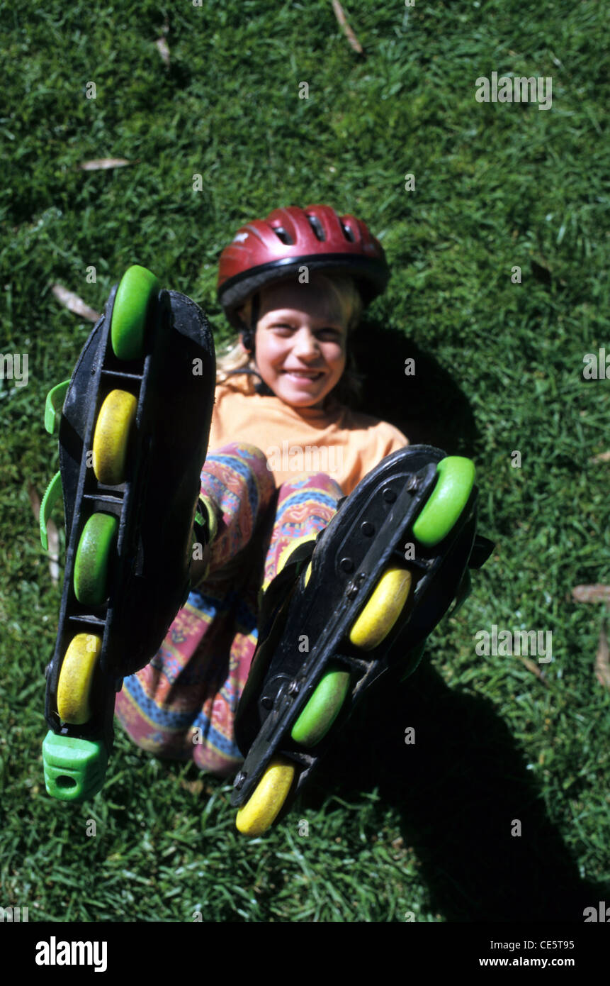 Young girl falling over from rollerblades Stock Photo - Alamy