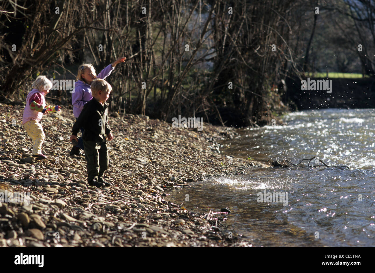 Young Children Throwing Stones High Resolution Stock Photography and ...