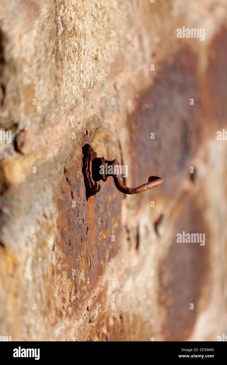 A rusty hook in a harbour wall Stock Photo - Alamy