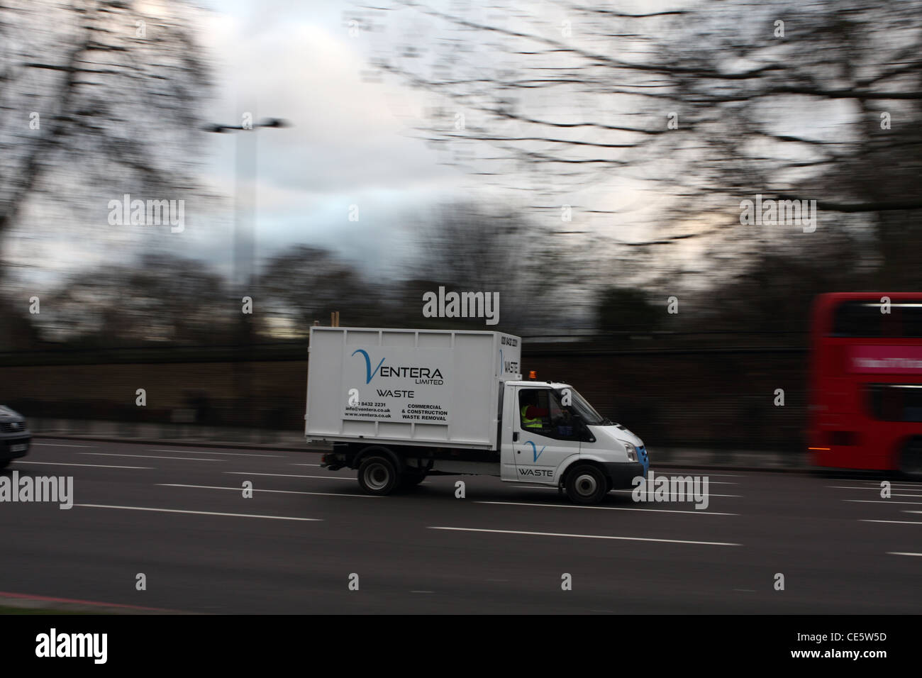 a van traveling along a road in London Stock Photo - Alamy