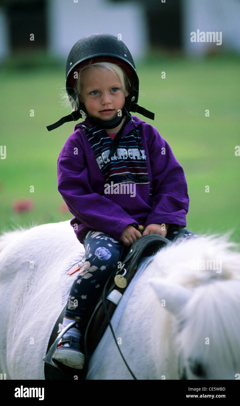 Child age 5 on pony Stock Photo - Alamy