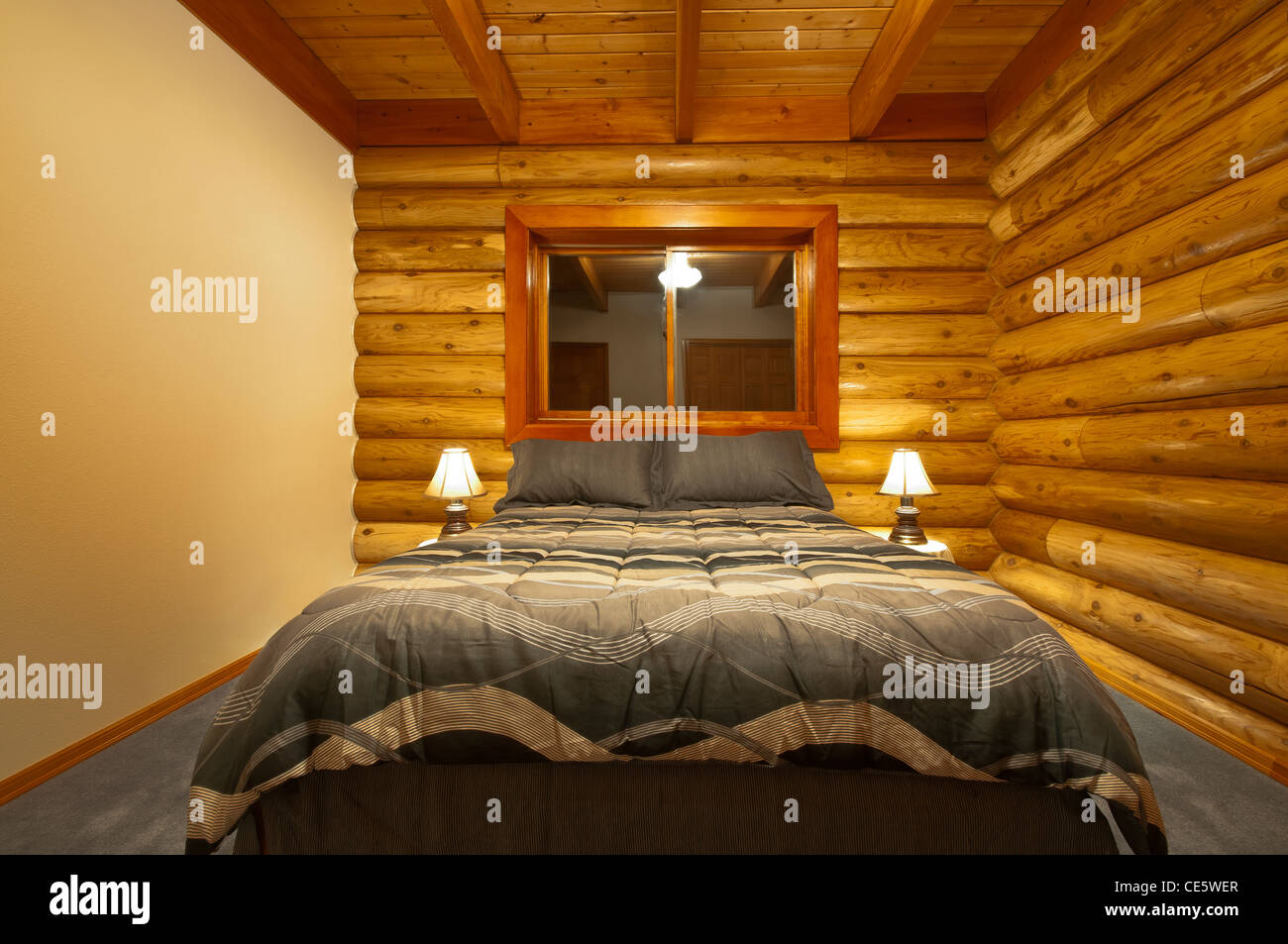 Bedroom in luxury log cabin featuring cedar logs and rustic trim Stock ...