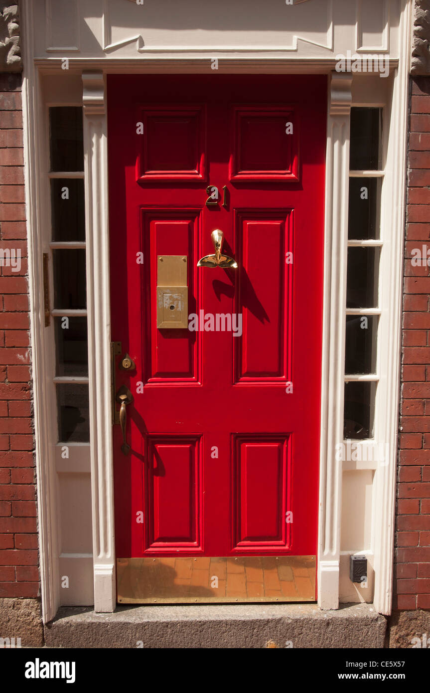 Red door with fishtail shape door handle and number 21 in Beacon Hill ...