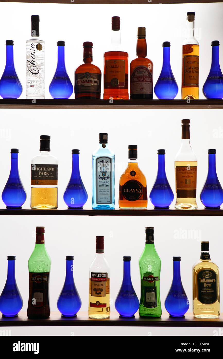 Bottles of spirits in a bar window display Stock Photo - Alamy
