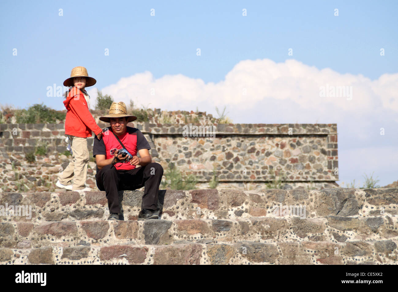 Mexicans sitting on the steps of a pyramid. San Juan Teotihuacán ...
