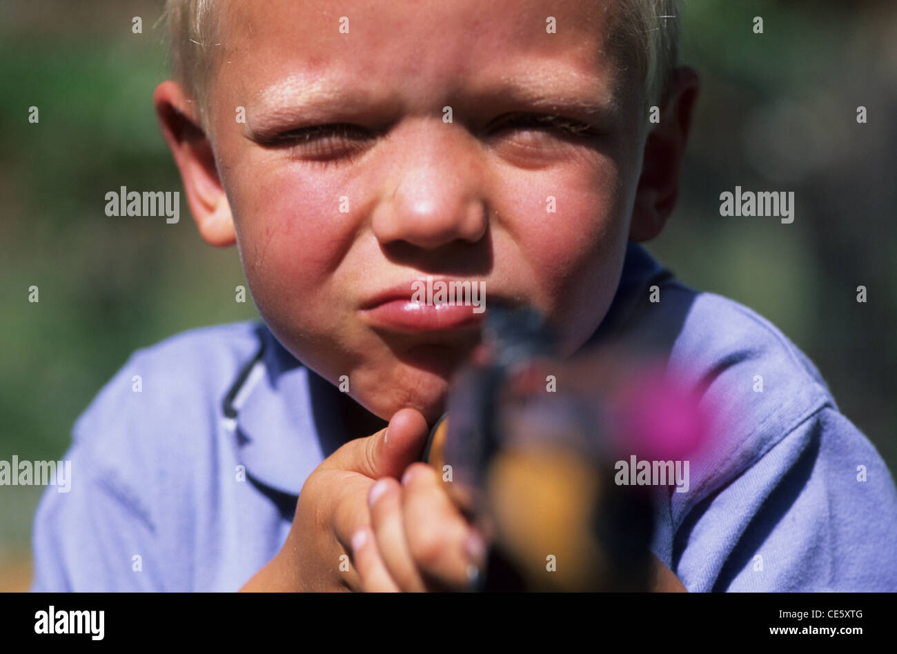 Boy firing hi-res stock photography and images - Alamy