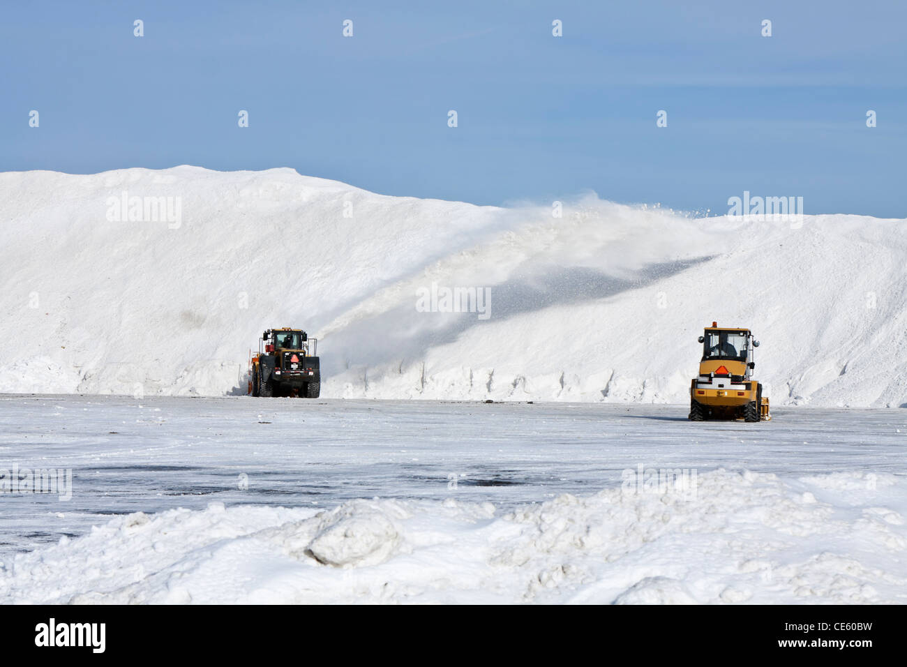 Snow plow blowing snow in a snow dump in Montreal, Canada Stock Photo ...