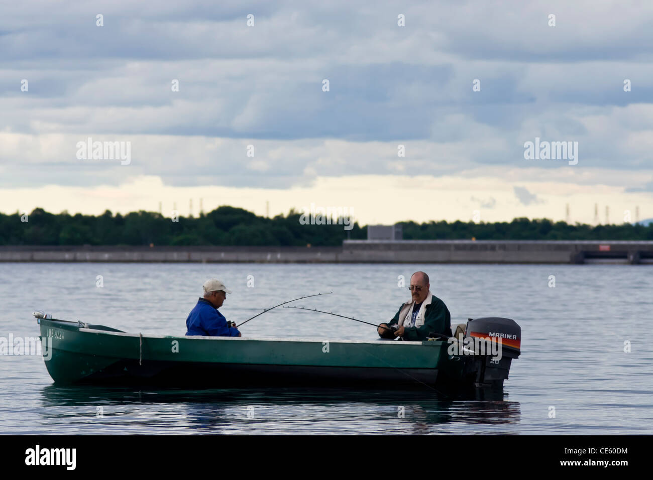 Fishermen fishing on a boat Stock Photo - Alamy