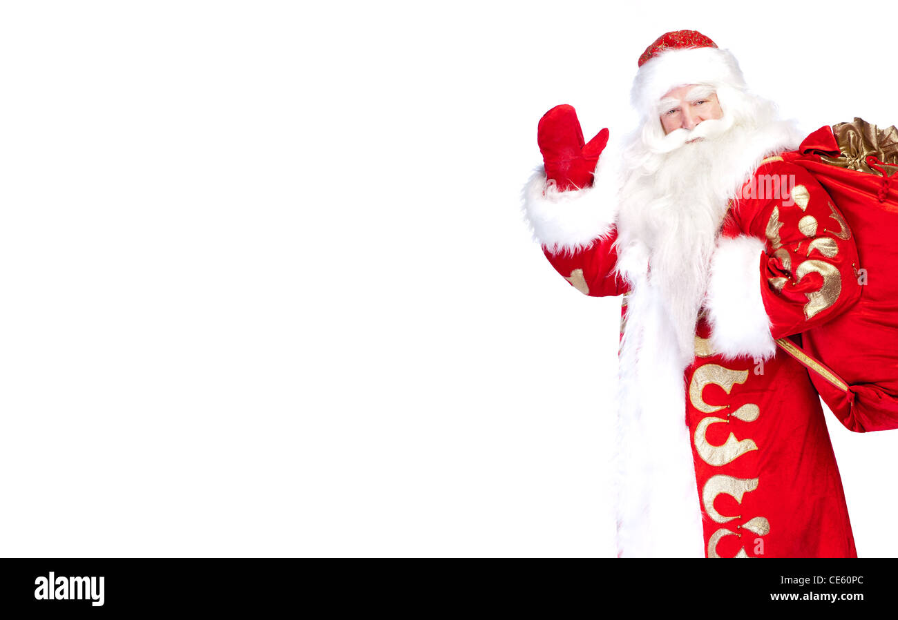Santa Claus standing up on white background with his bag full of gifts ...