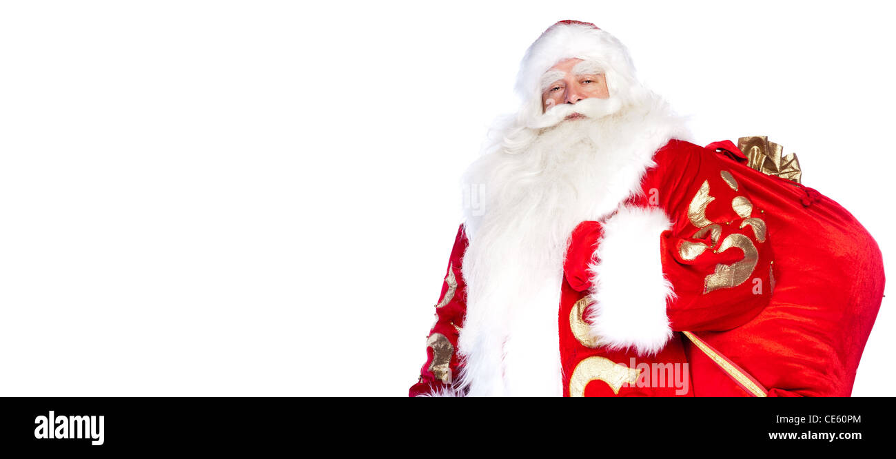 Santa Claus standing up on white background with his bag full of gifts ...