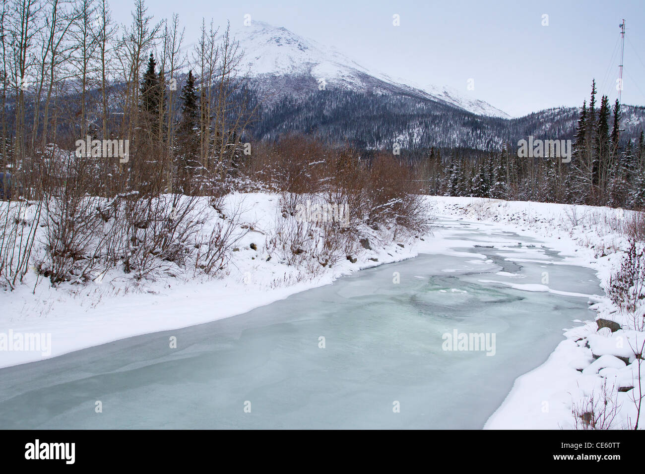 Scenic snowy winter landscape of Koyukuk River partially iced over at ...