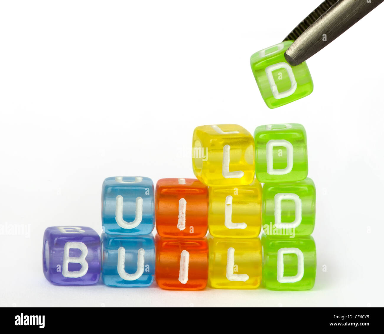 Text build on colorful wooden cubes over white Stock Photo - Alamy