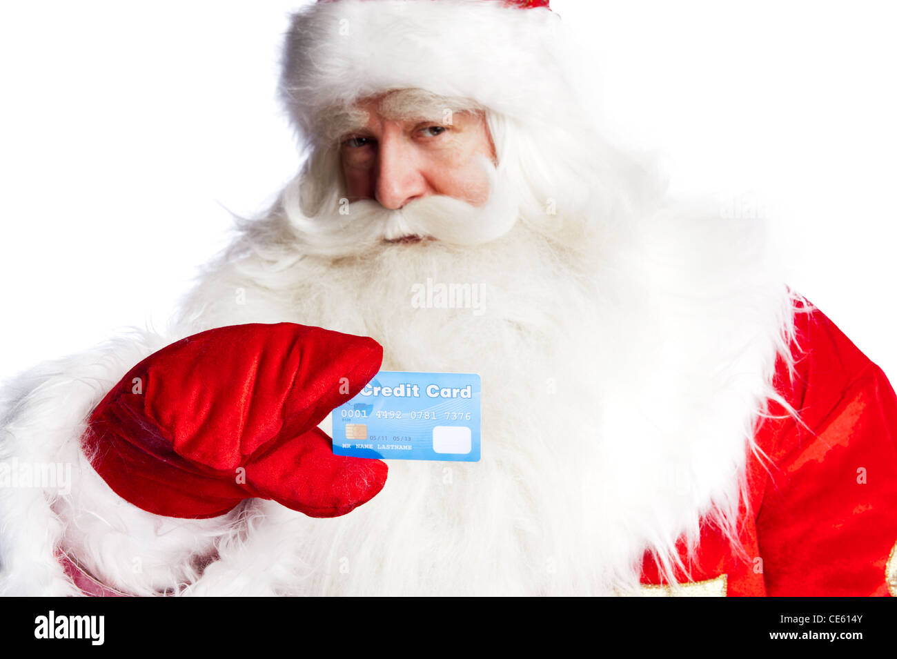 Traditional Santa Claus holding and sowing credit card while giving a ...