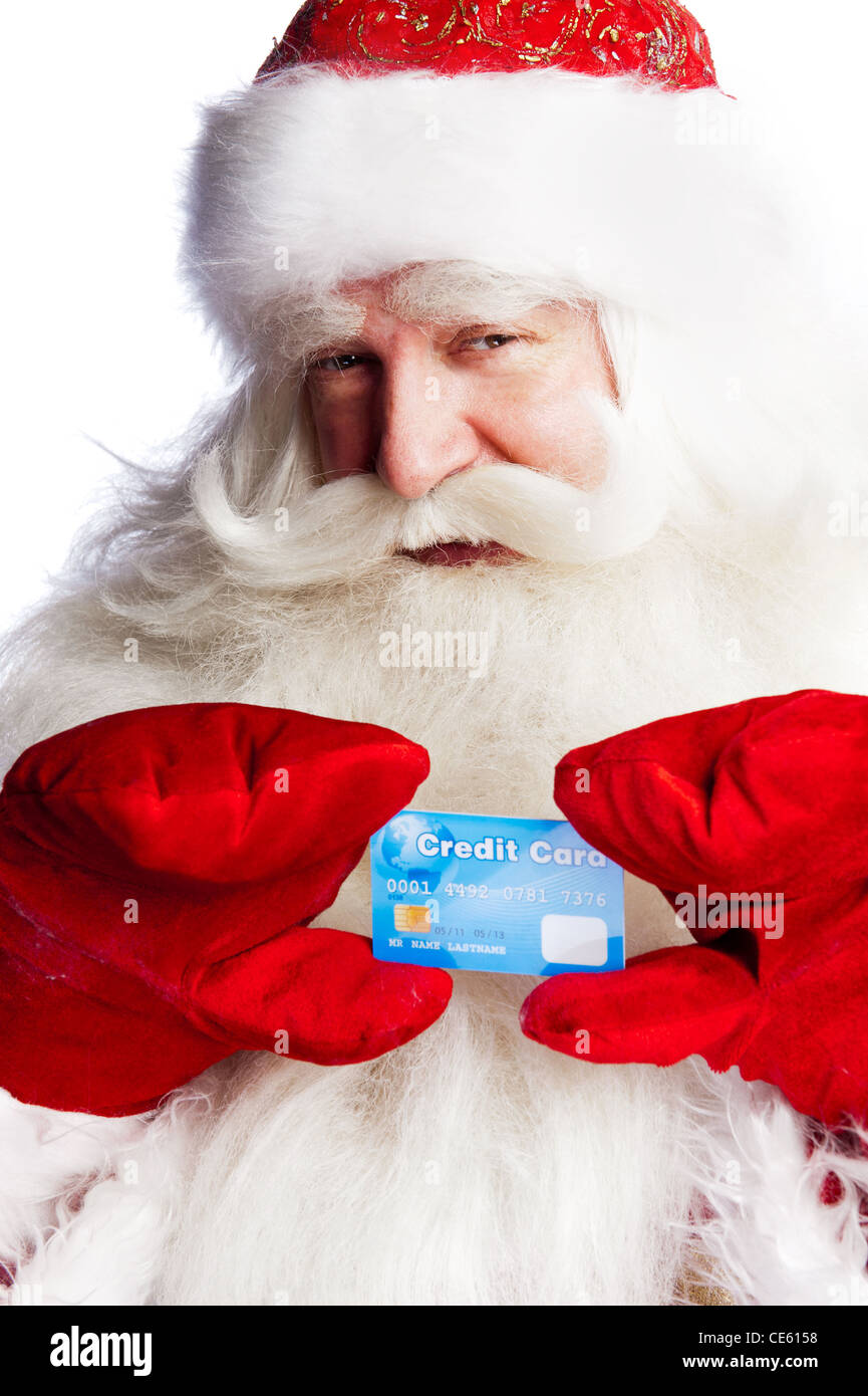 Traditional Santa Claus holding and sowing credit card while giving a ...