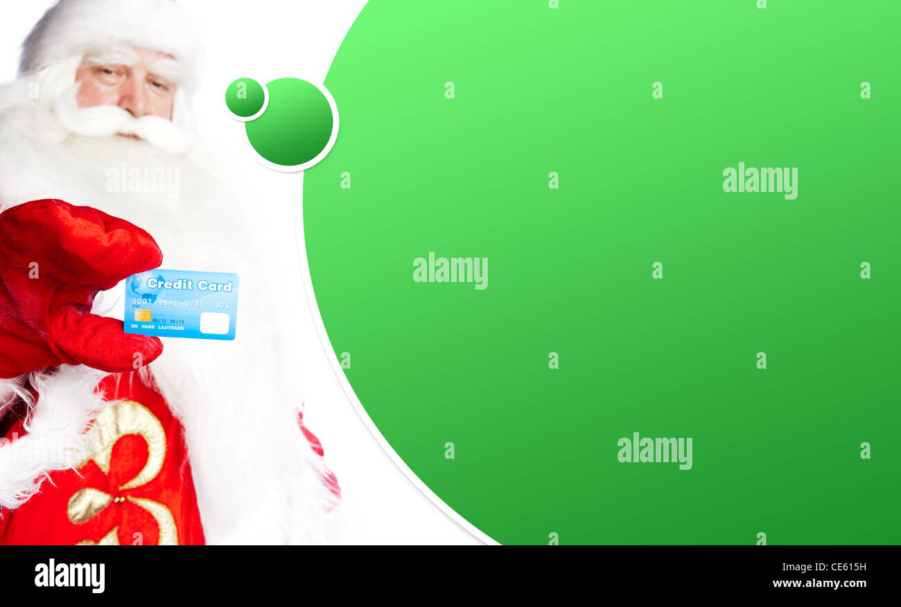 Traditional Santa Claus holding and sowing credit card while giving a ...