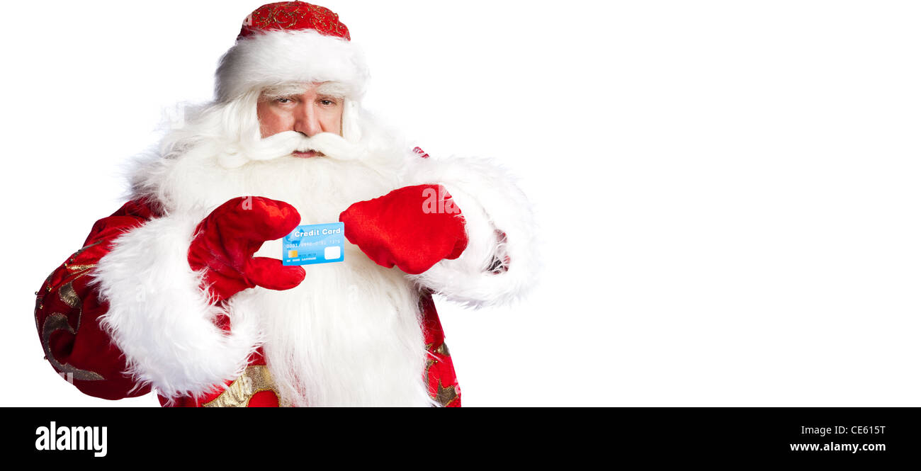 Traditional Santa Claus holding and sowing credit card while giving a ...