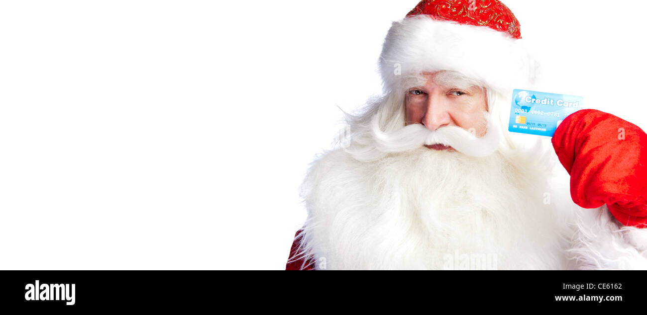 Traditional Santa Claus holding and sowing credit card while giving a ...