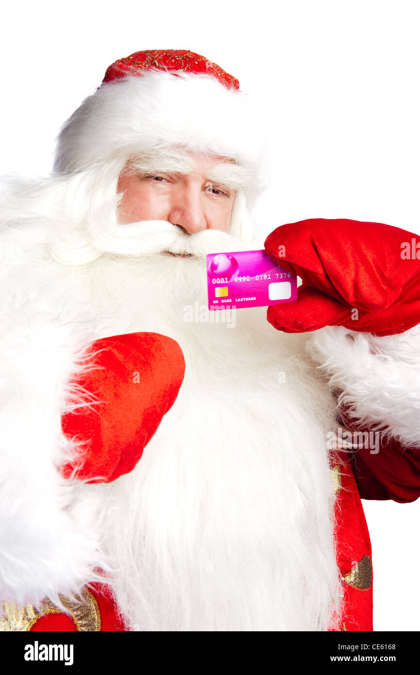 Traditional Santa Claus holding and sowing credit card while giving a ...