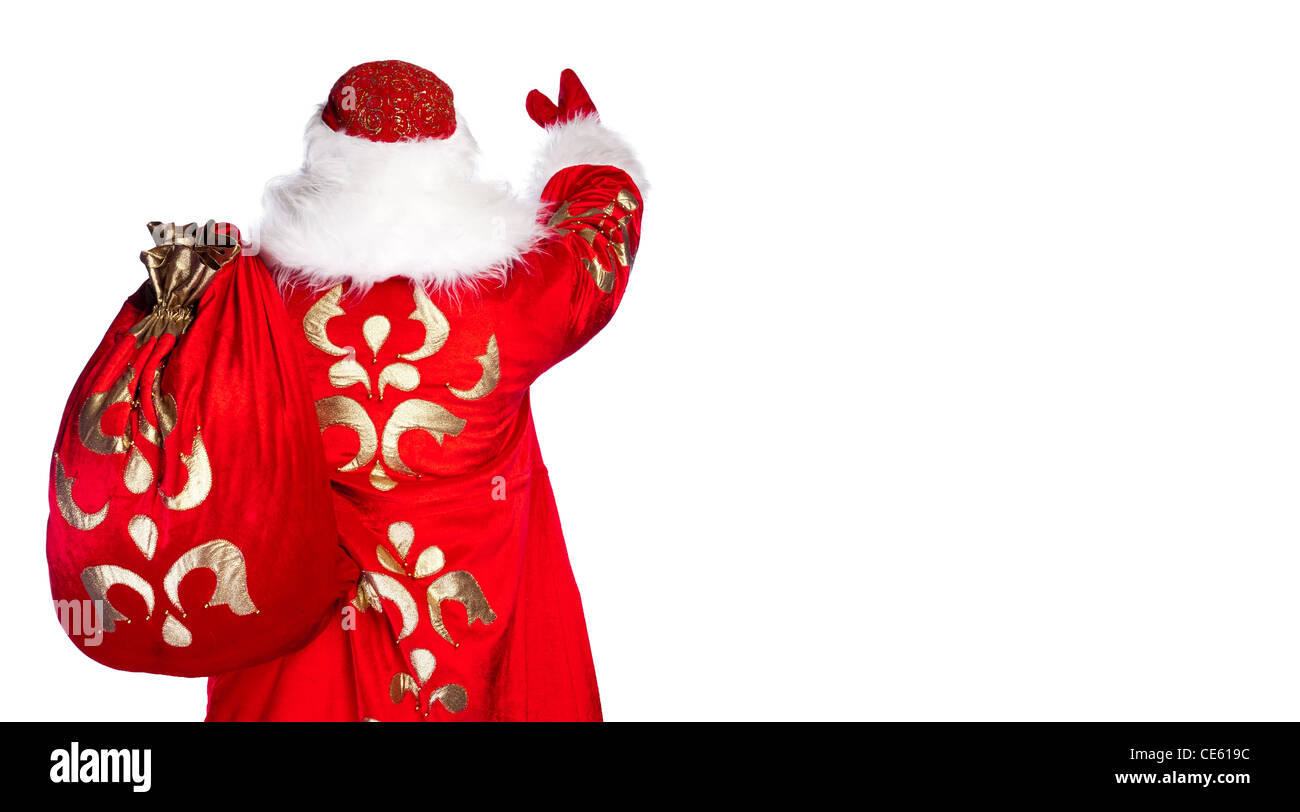 Santa Claus standing up on white background with his bag full of gifts ...