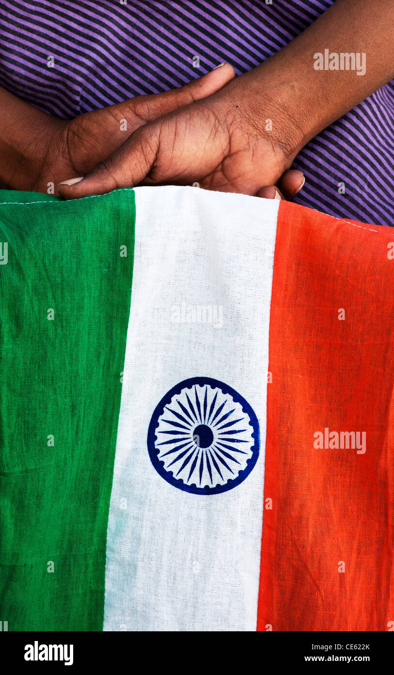 Indian mans hands holding an Indian flag Stock Photo - Alamy