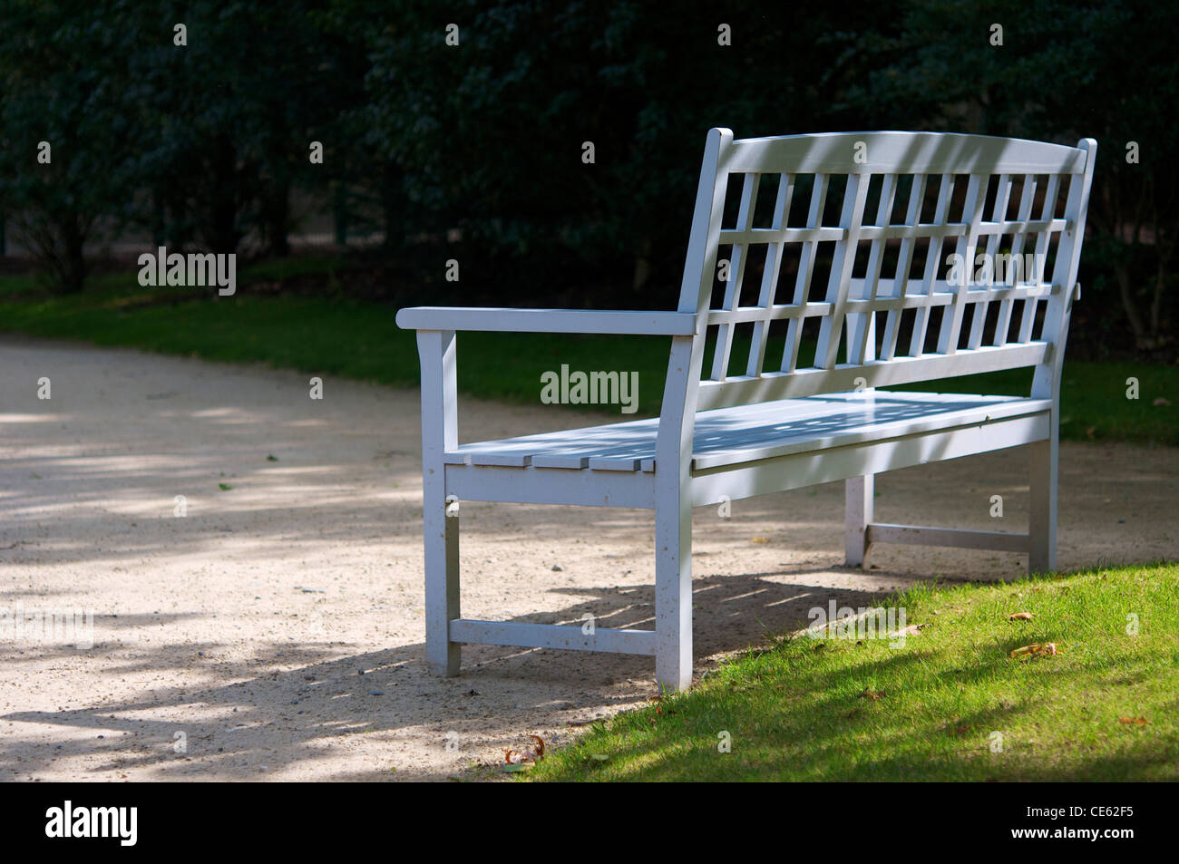 White wooden bench in a public park in Granville Stock Photo - Alamy