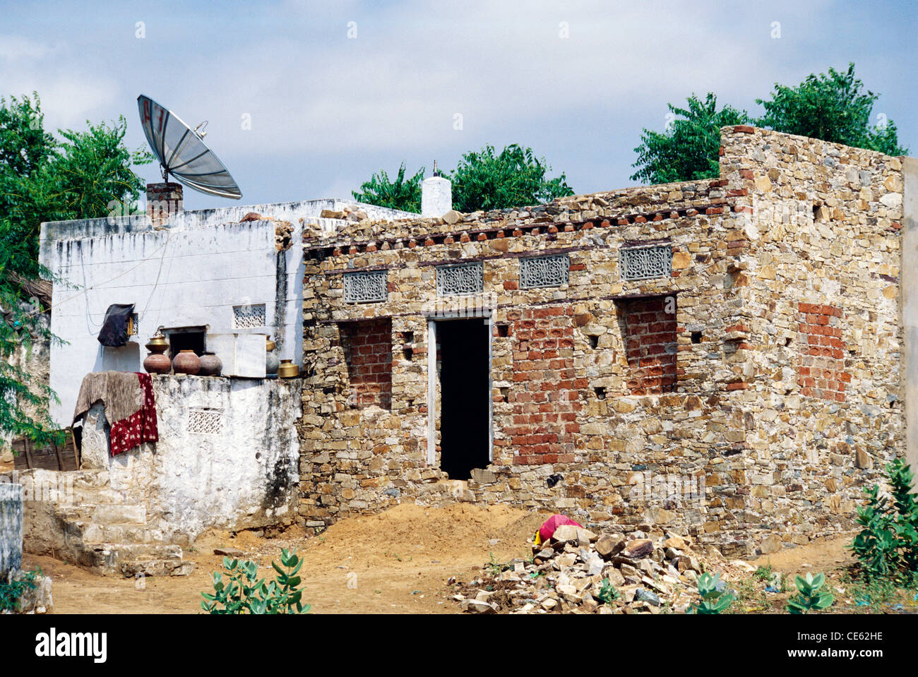 TV television Dish Antenna on Rajasthani village house ; Rajasthan ...