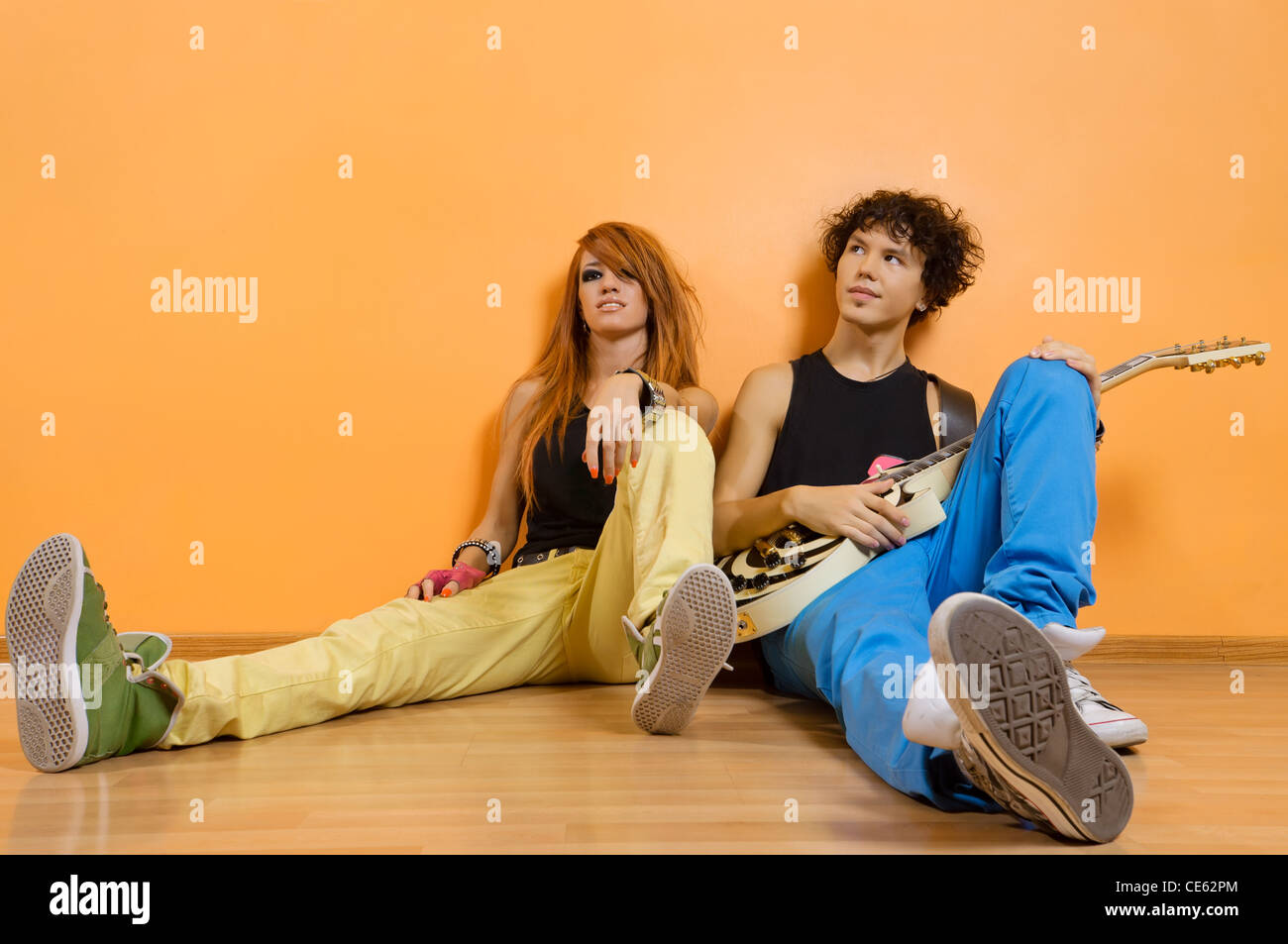 Two rock band members relaxing at the studio Stock Photo - Alamy