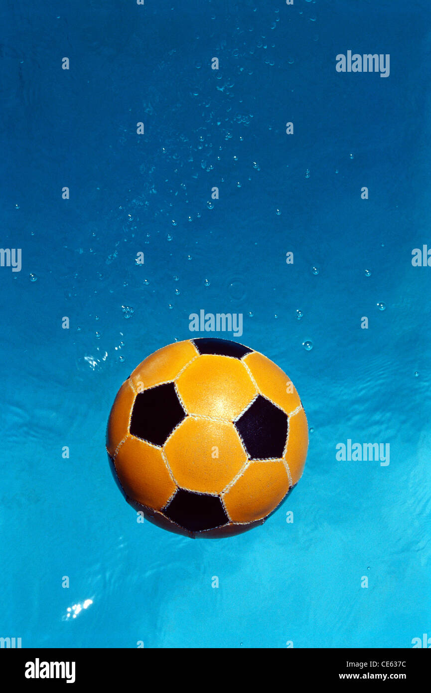 football floating on swimming pool water Stock Photo - Alamy