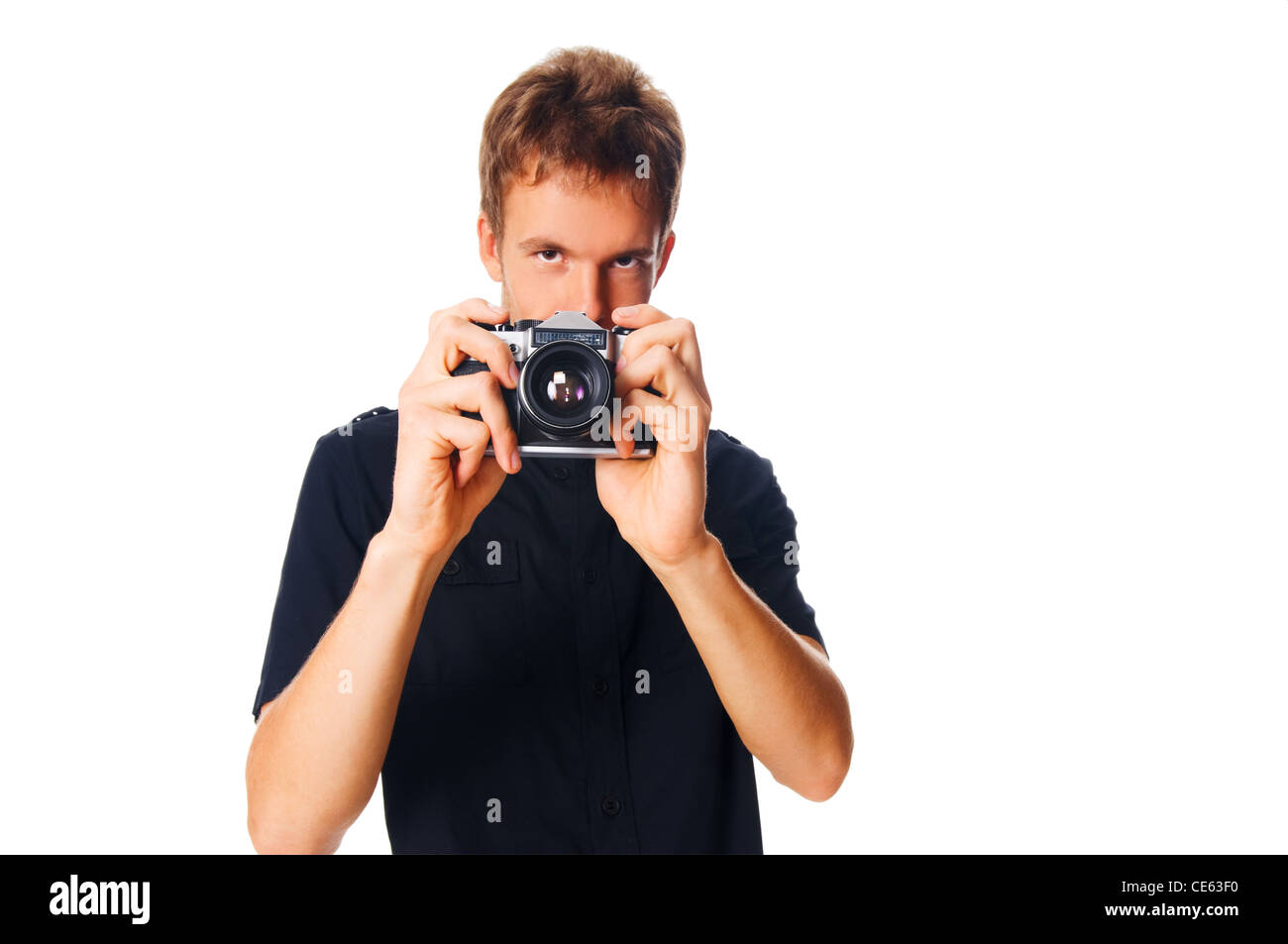 Young man with camera isolated on white background Stock Photo - Alamy