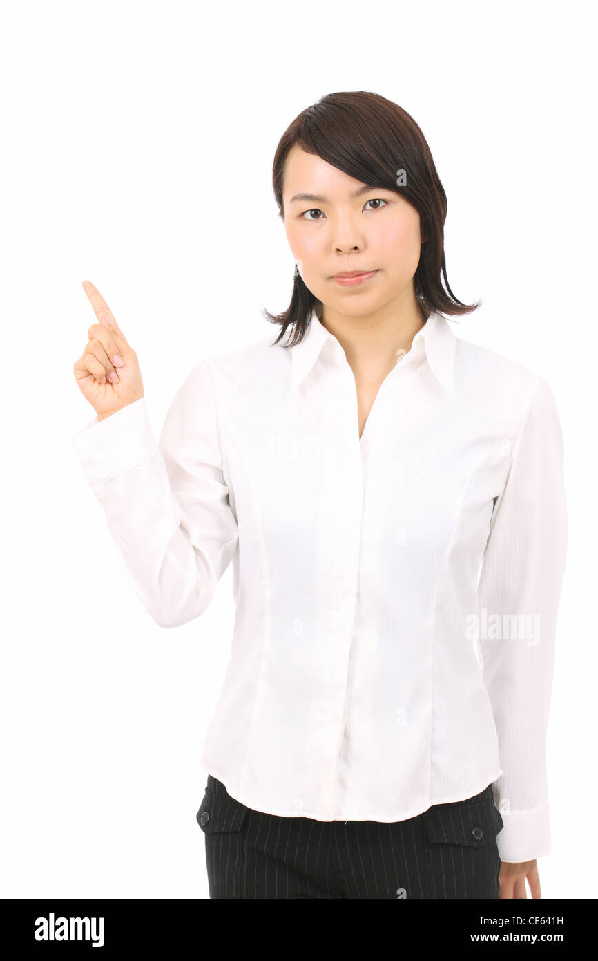Smiling asian business woman rise hand and pointing copy space Stock ...