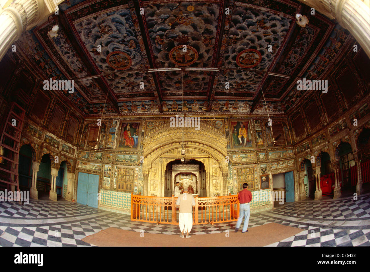 Interior of temple ; black and white stone flooring ; painted ceiling ...